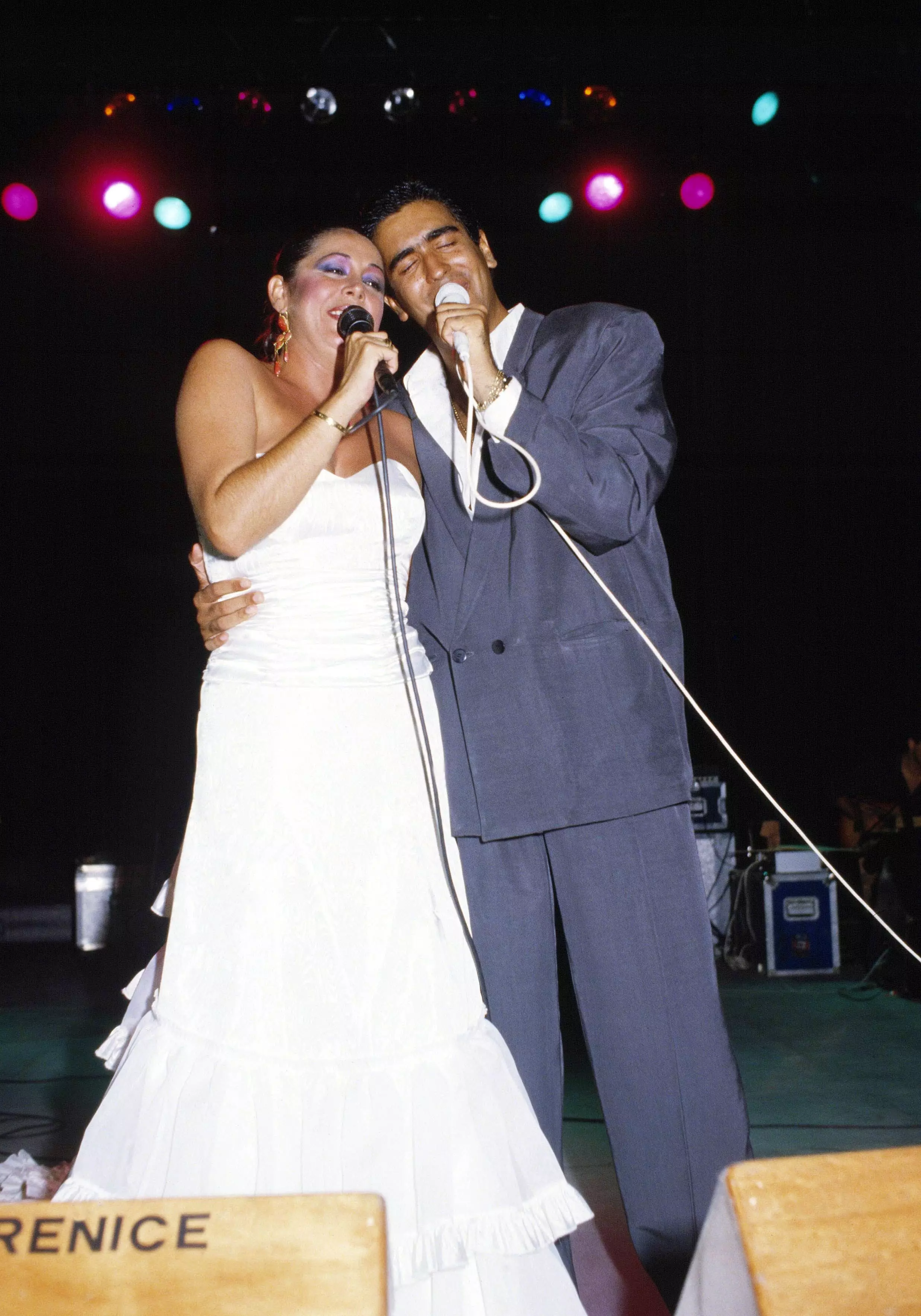 isabel pantioja and her brother agustin pantoja singing on stage