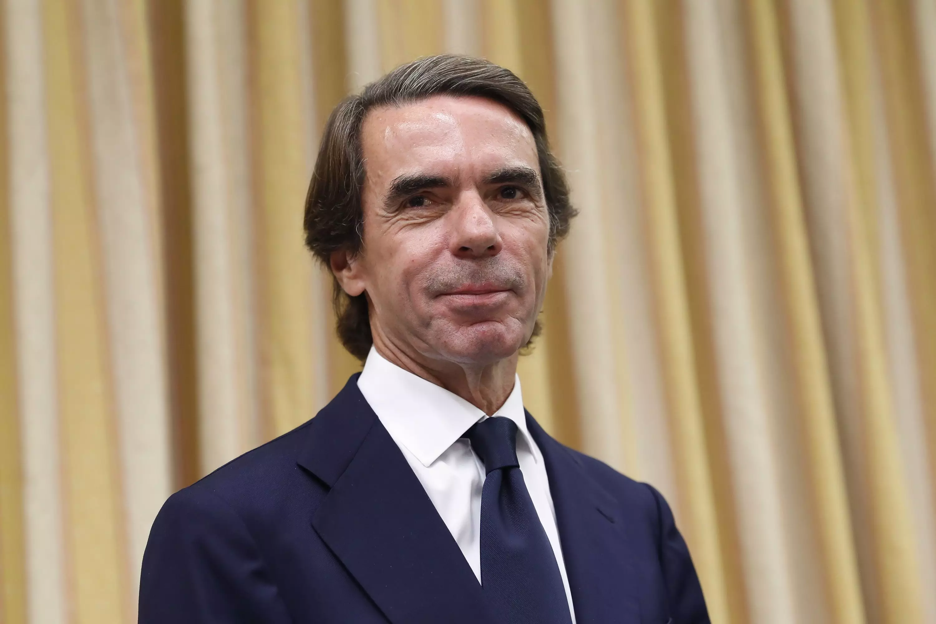 tsohon shugaban kasar Spain José Maria aznar yana murmushi