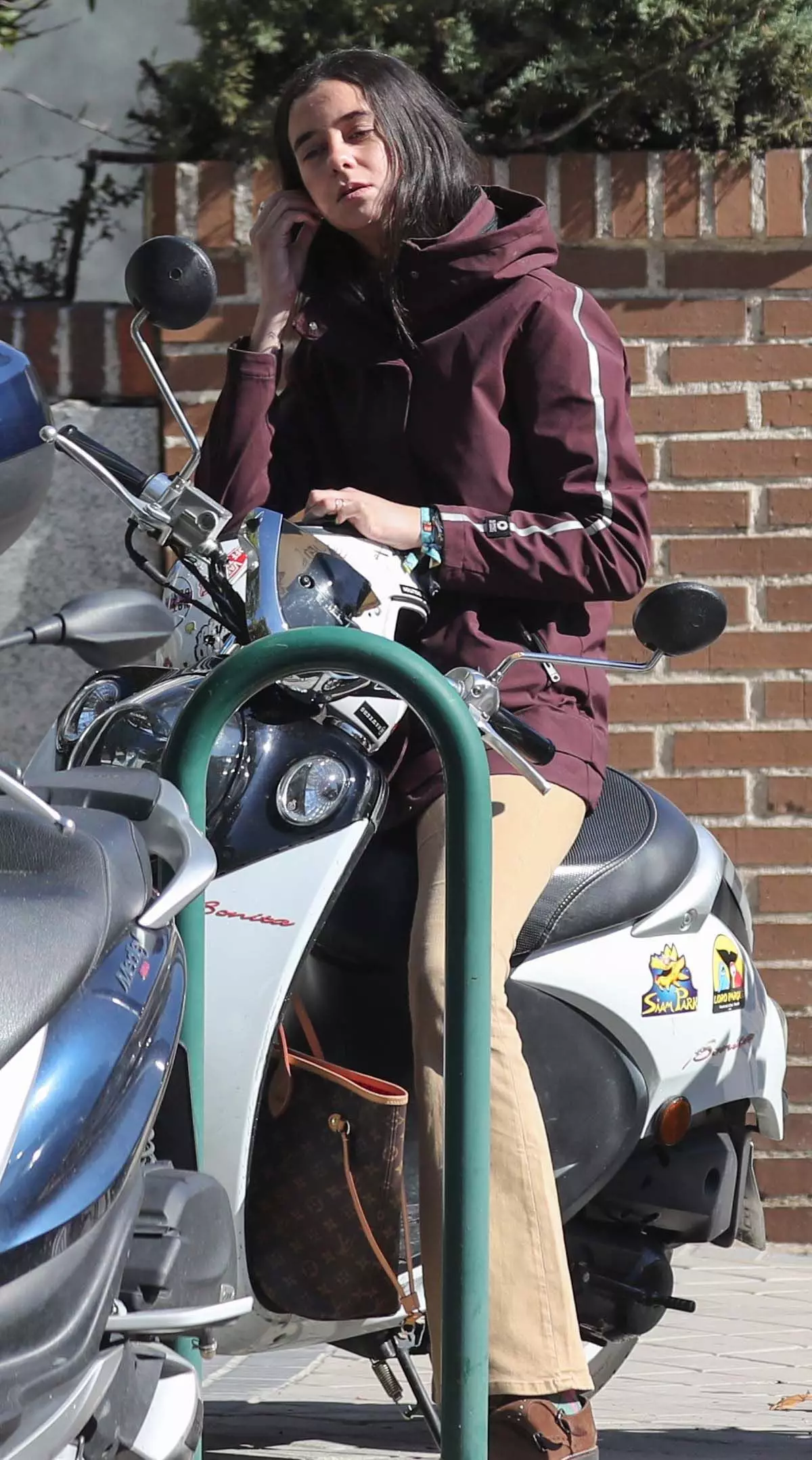 Victoria Federica rides a motorcycle through the streets of Madrid