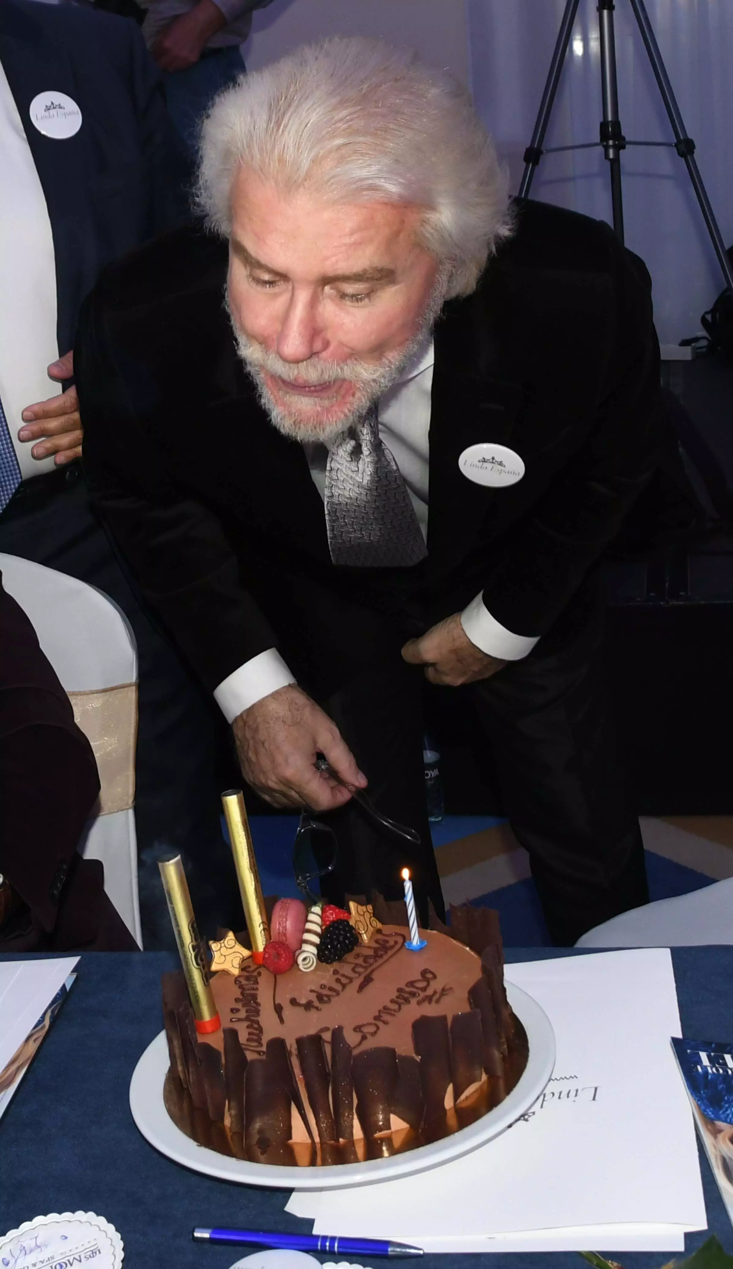 Edmundo Arrocet blows the cake for his 70th birthday