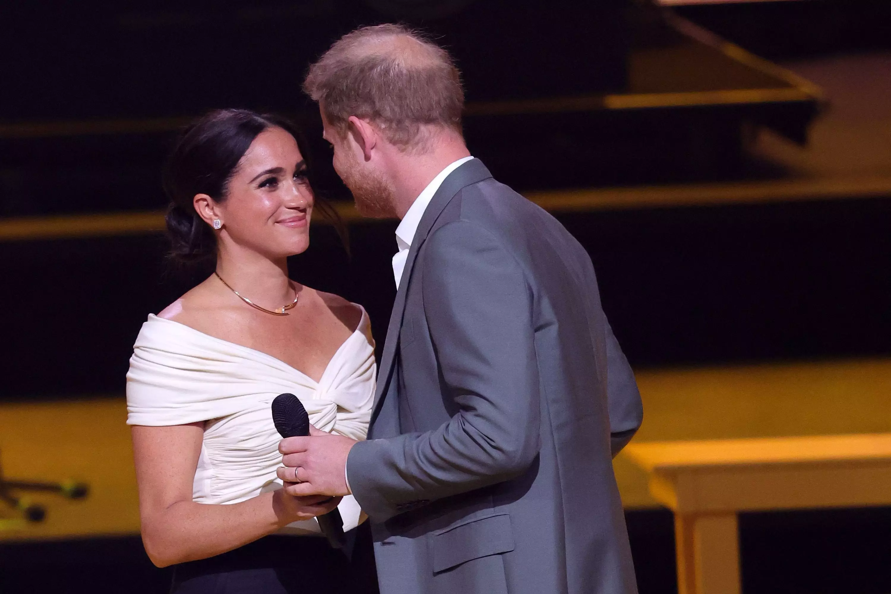 Meghan Markle and Prince Harry kiss in public