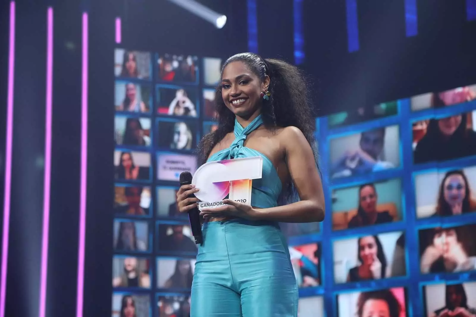 nia poses at home plate with the ot 2020 winner trophy