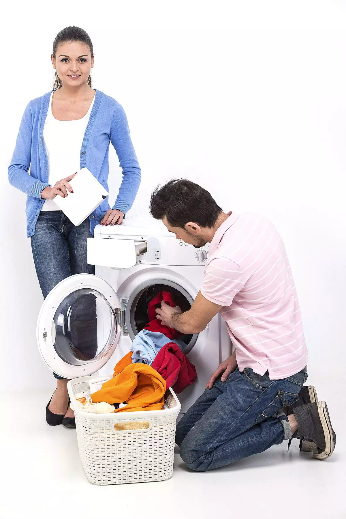 a man and a woman next to a washing machine