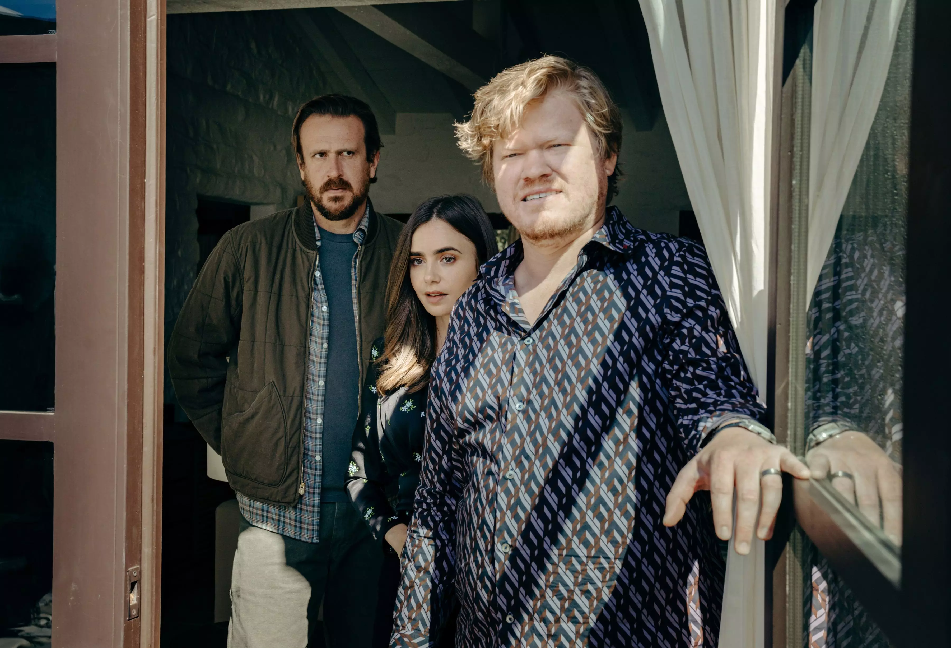windfall l r lily collins as wife, jesse plemons as ceo and jason segel as nobody cr netflix © 2022