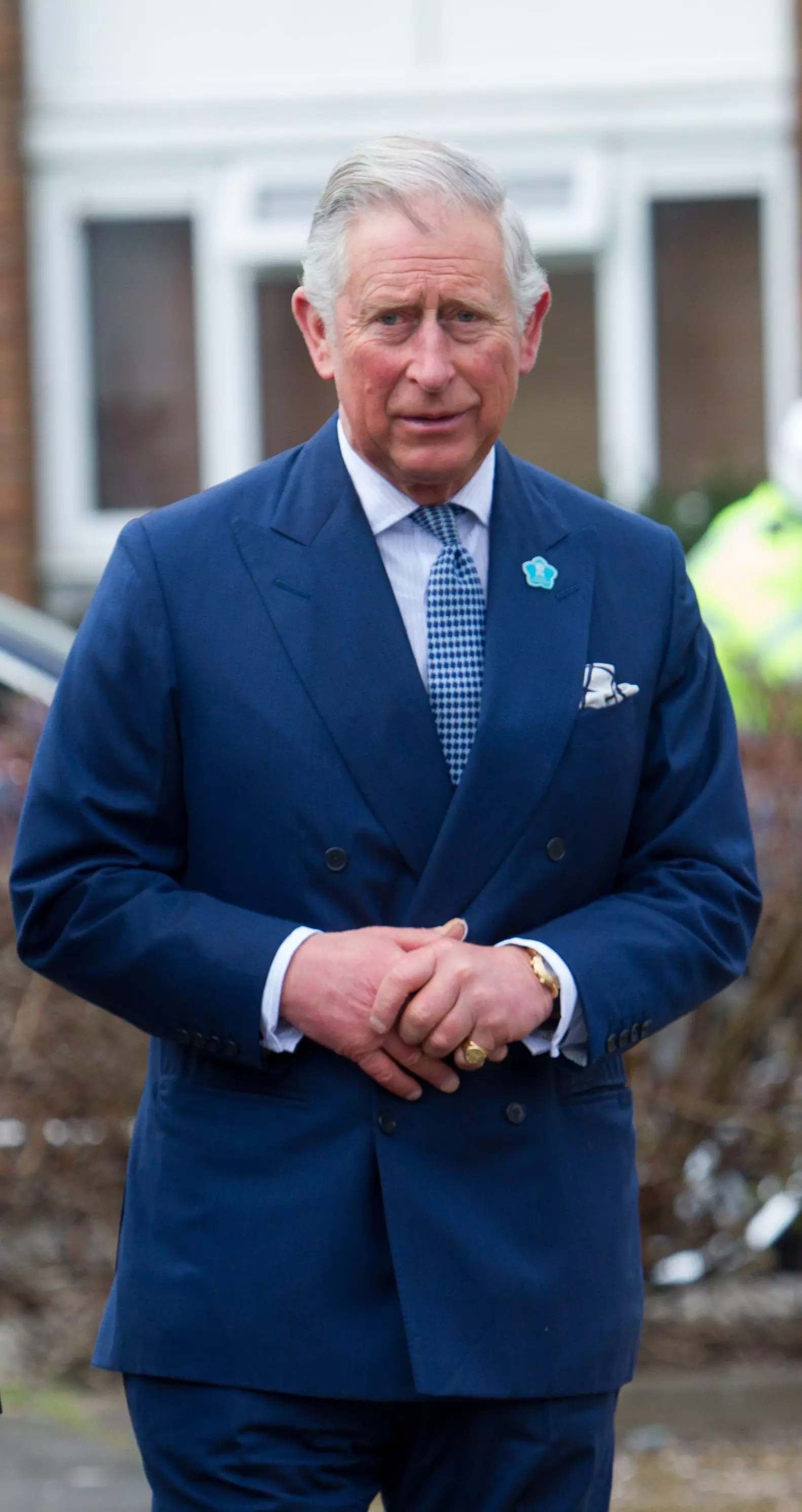 prince charles posing with folded hands