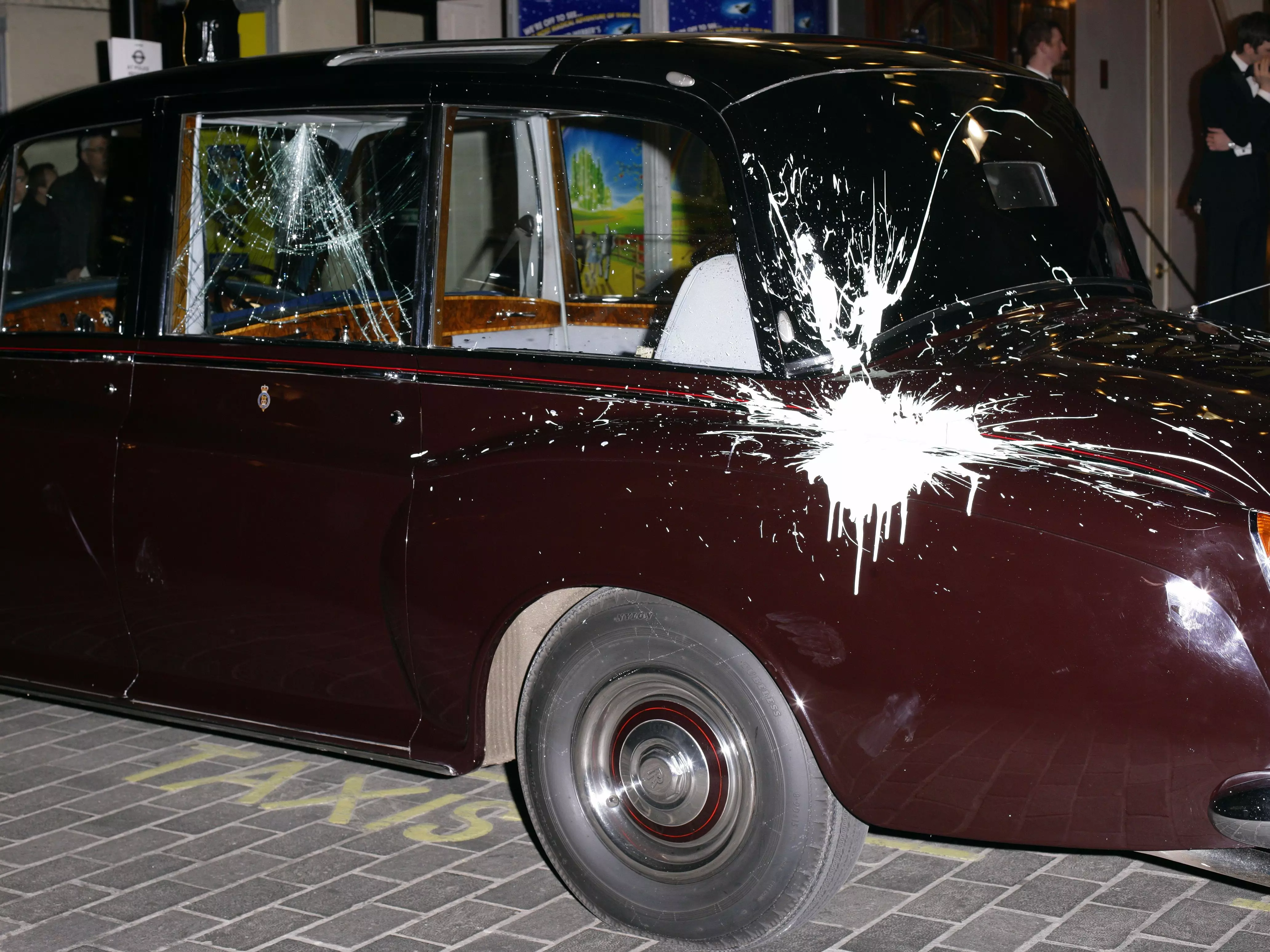 the rolls royce of prince charles and camilla parker, attacked by some students