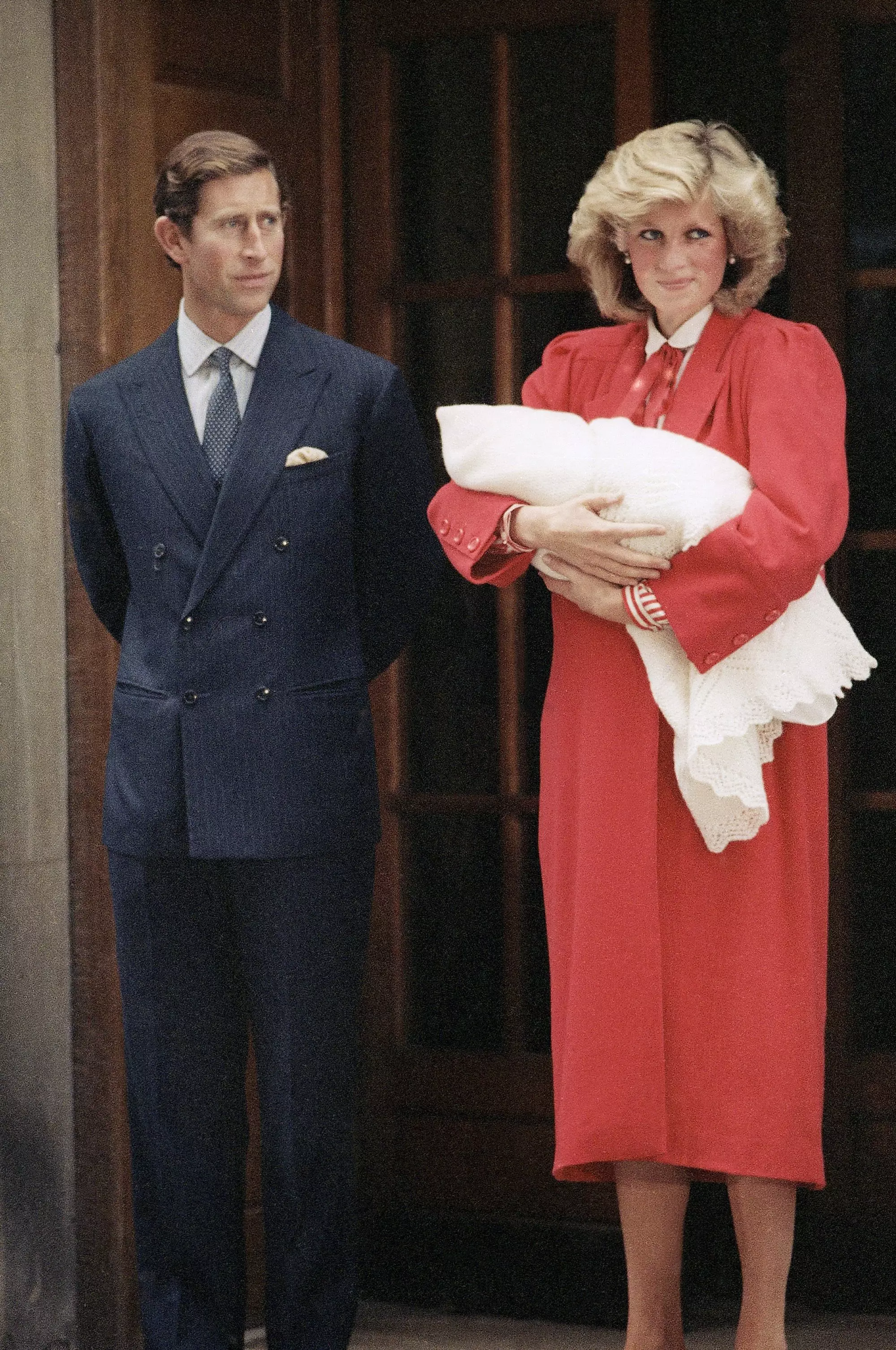 the prince and princess of wales leaving hospital with their son harry